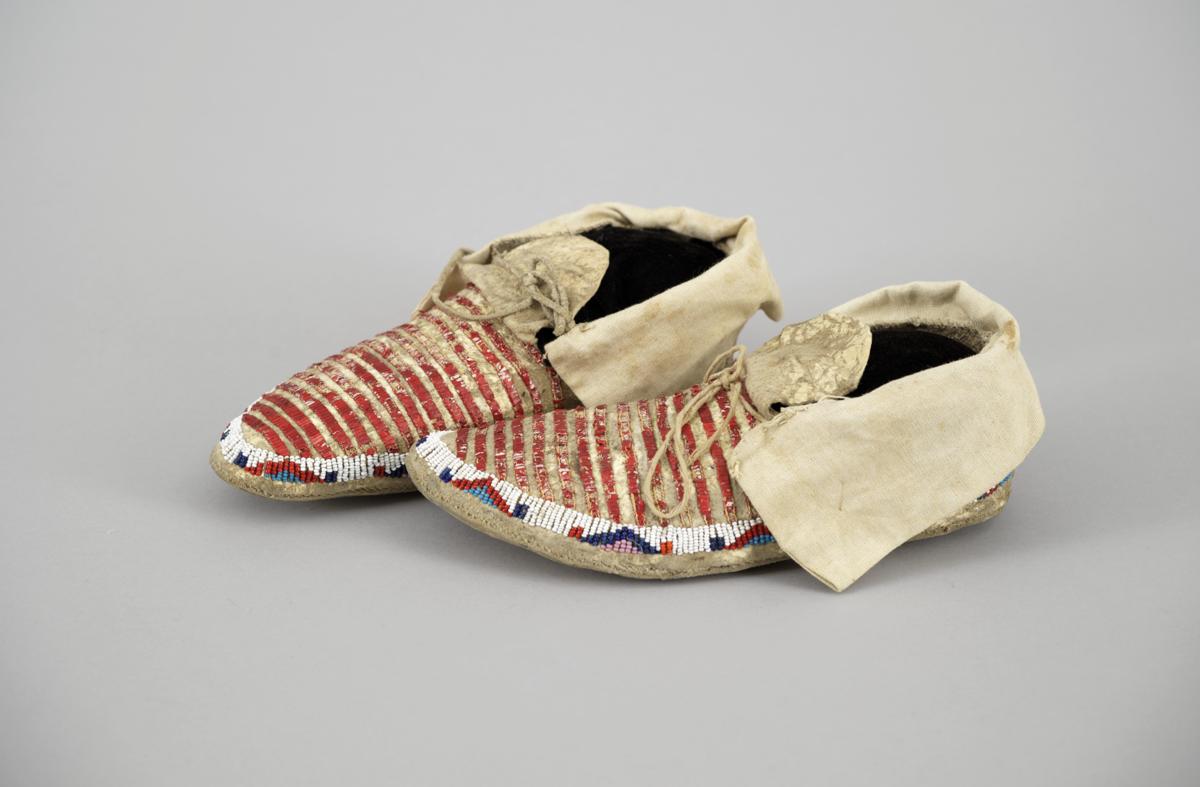 Beaded leather moccasins with geometric designs